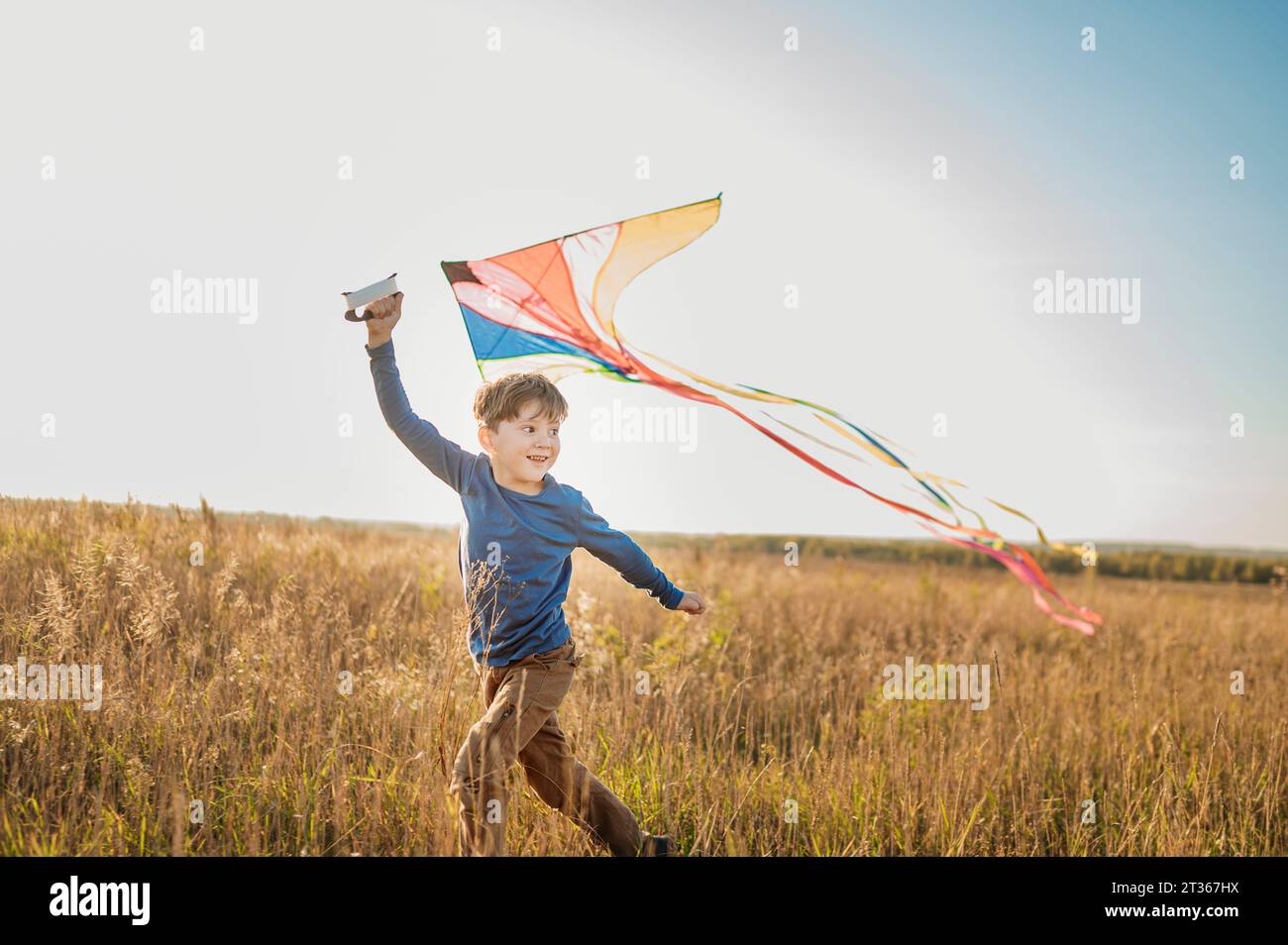 Child running with kite hi-res stock photography and images - Alamy