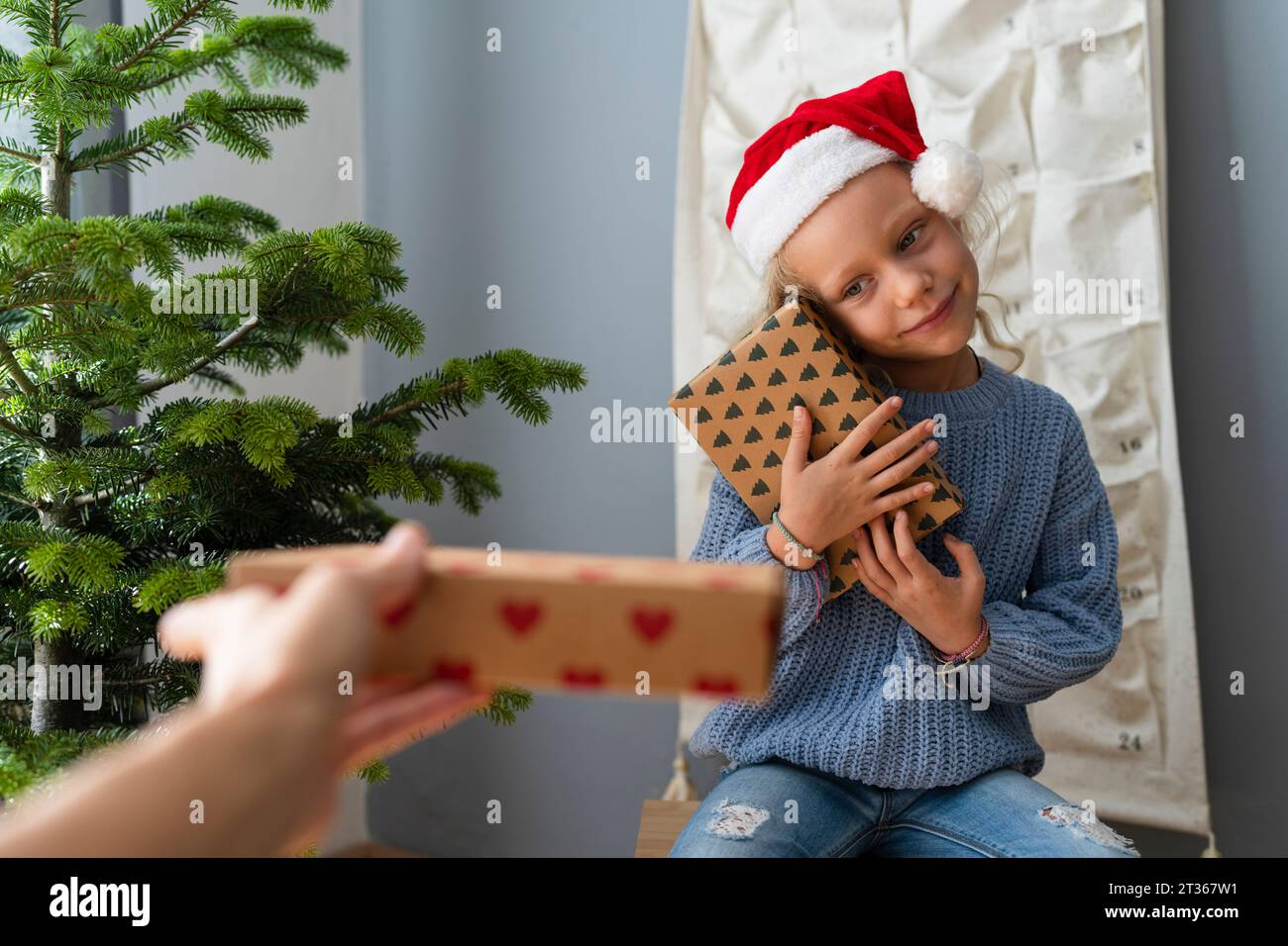 Child giving present hi-res stock photography and images - Alamy