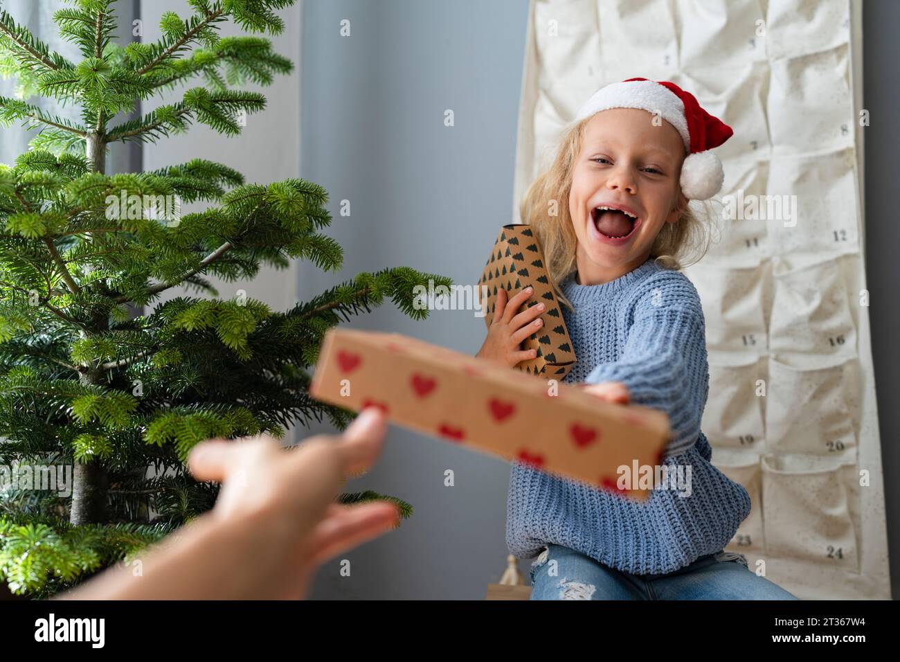 Child giving present hi-res stock photography and images - Alamy