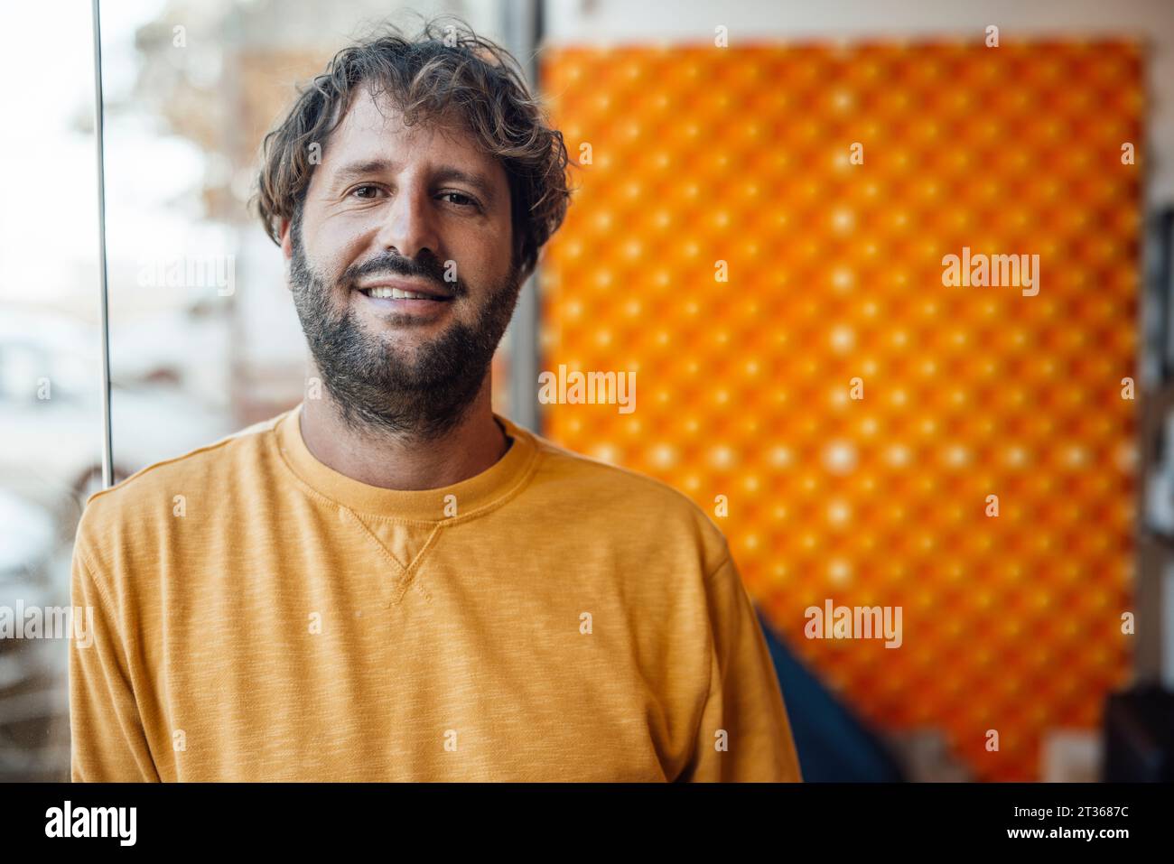 Smiling man glass wall hi-res stock photography and images - Alamy