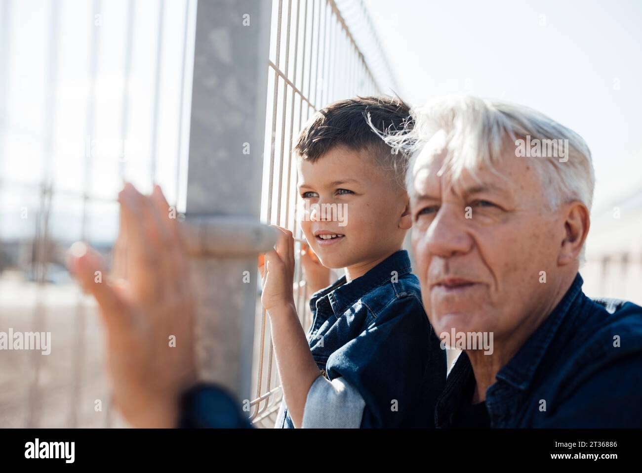 Boy looking up man hi-res stock photography and images - Alamy
