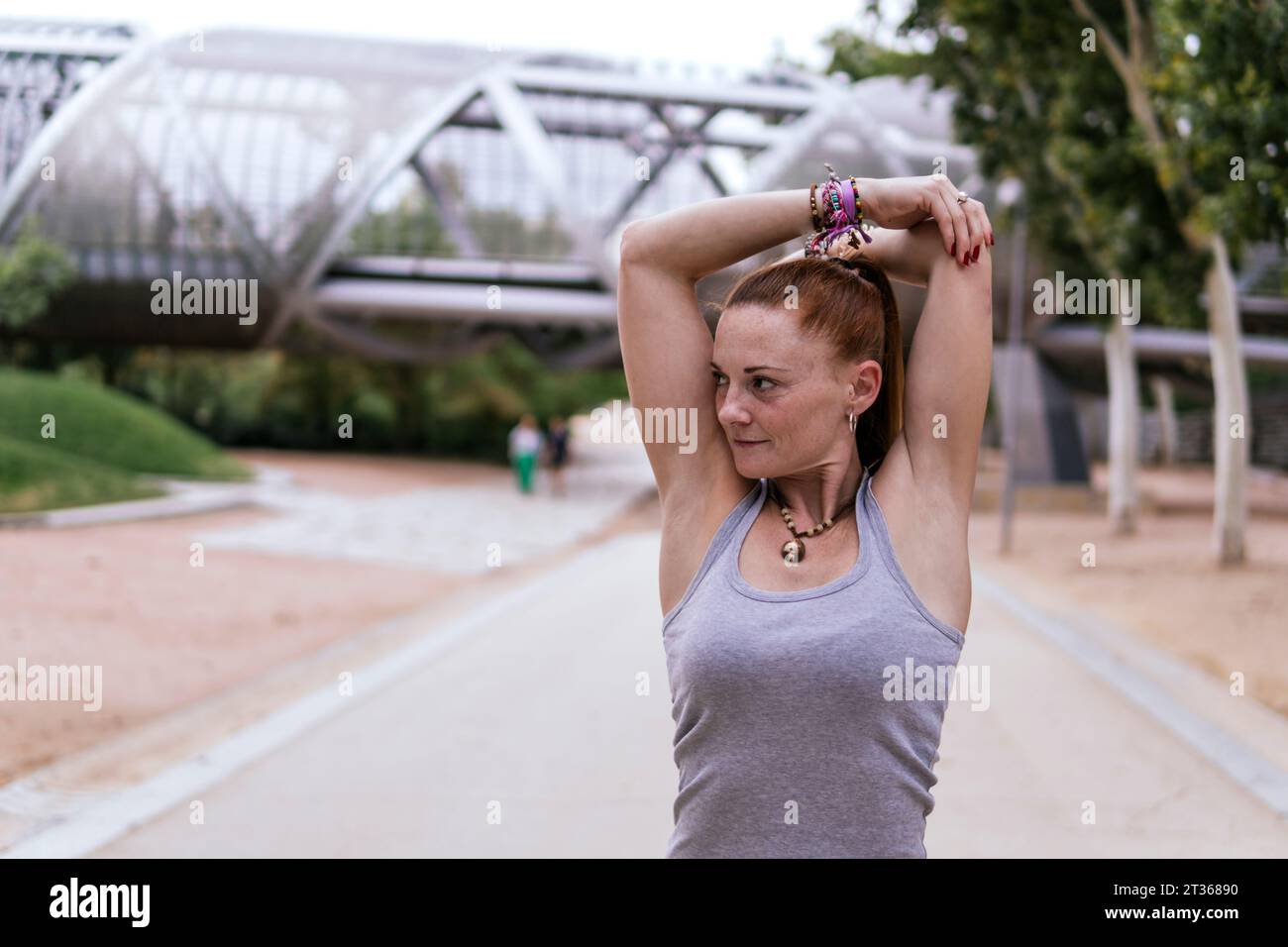 Women stretching arms hi-res stock photography and images - Alamy