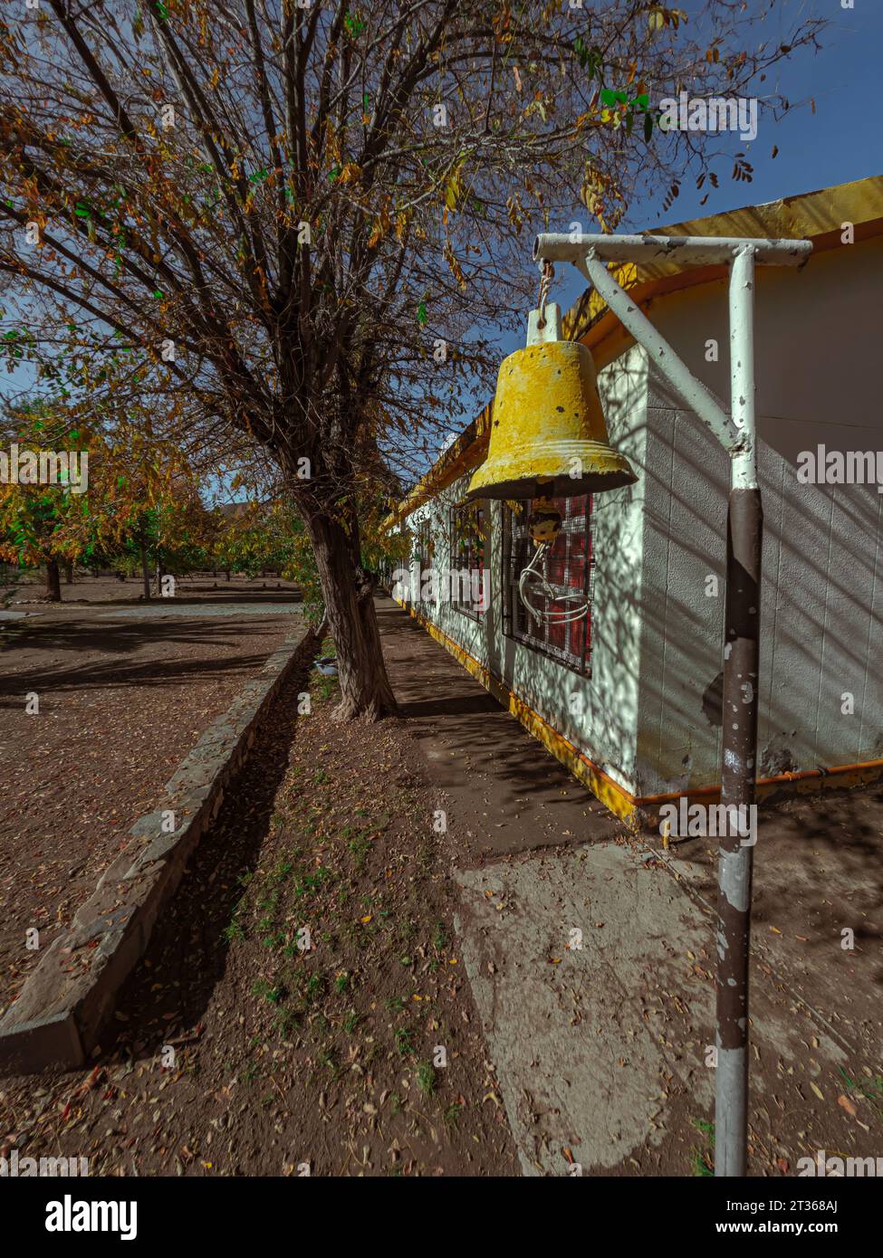 Rural school in Cerro Cóndor with the bell for recess Stock Photo - Alamy