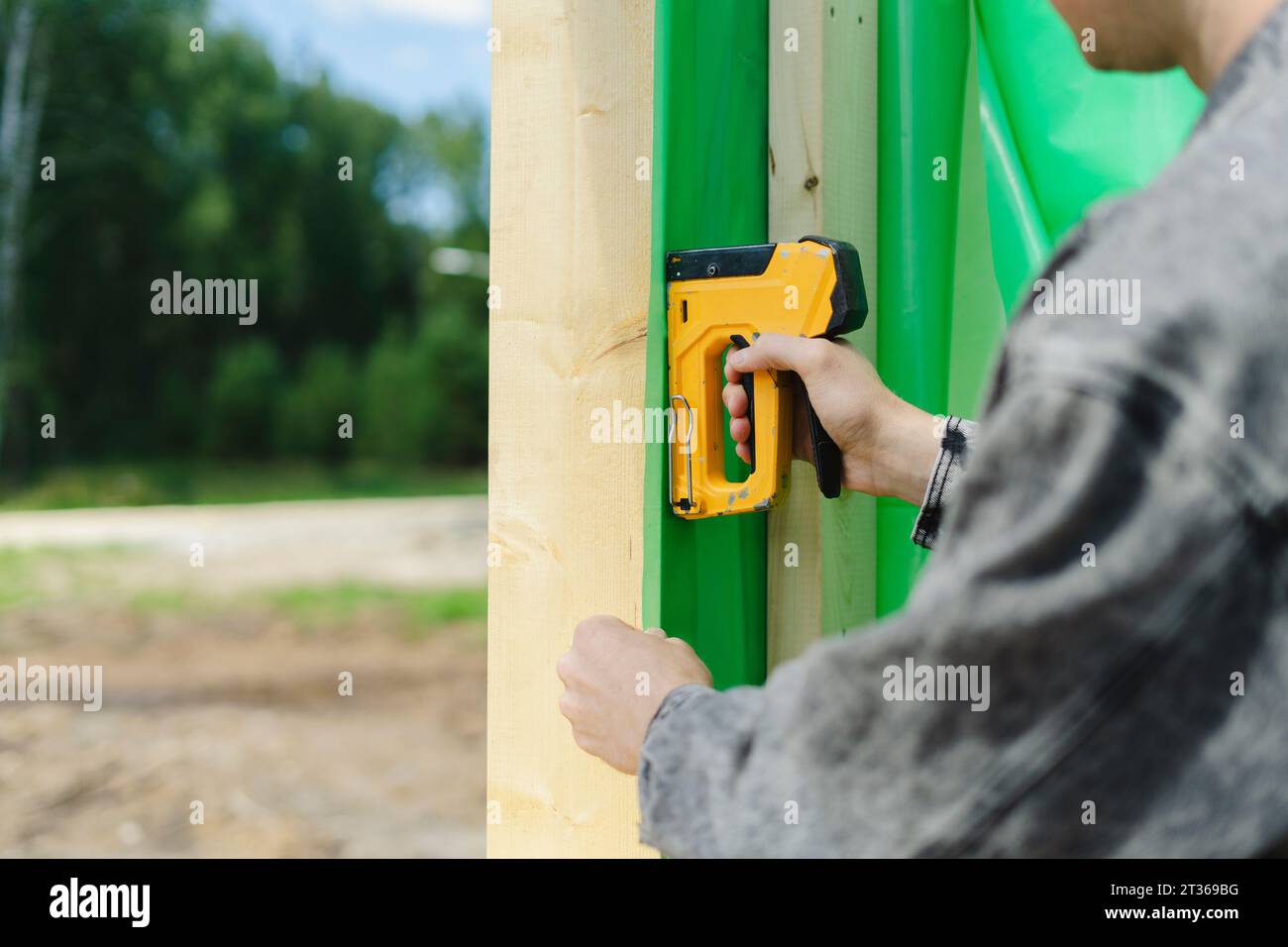 Engineer working with tool at construction site Stock Photo - Alamy