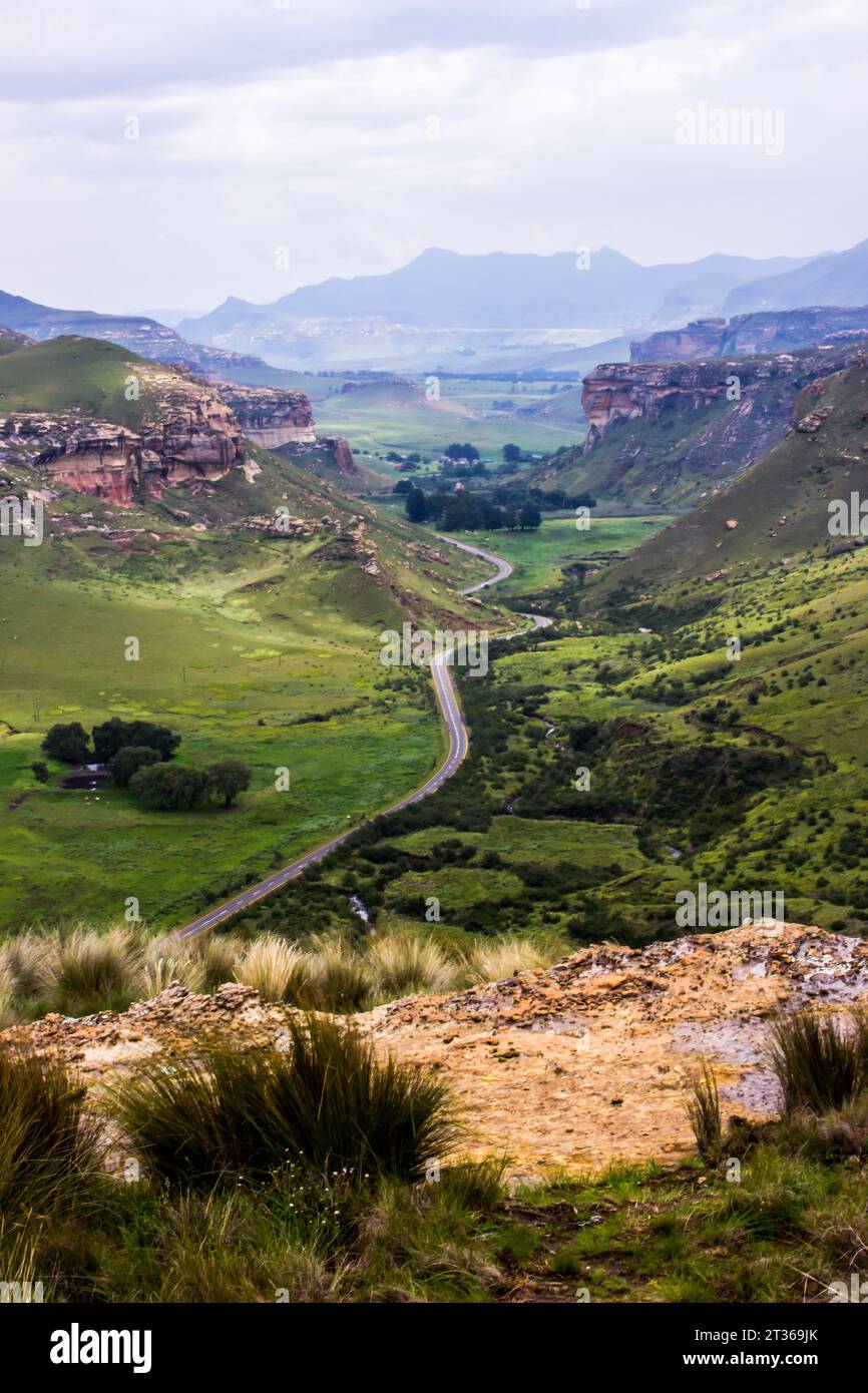 Highway meandering through a valley in the Free state Drakensberg, in ...