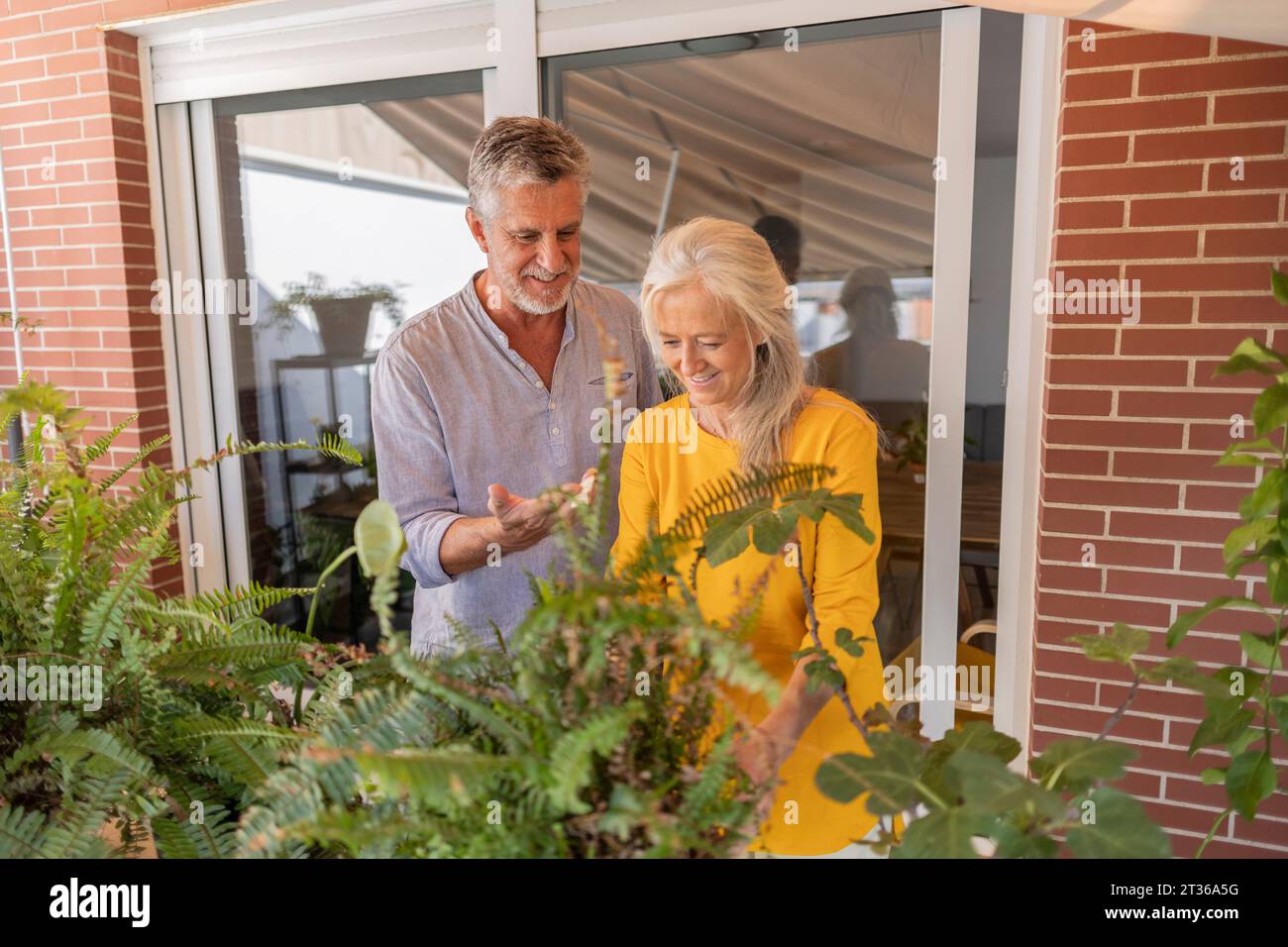 Gardening couple balcony hi-res stock photography and images - Alamy