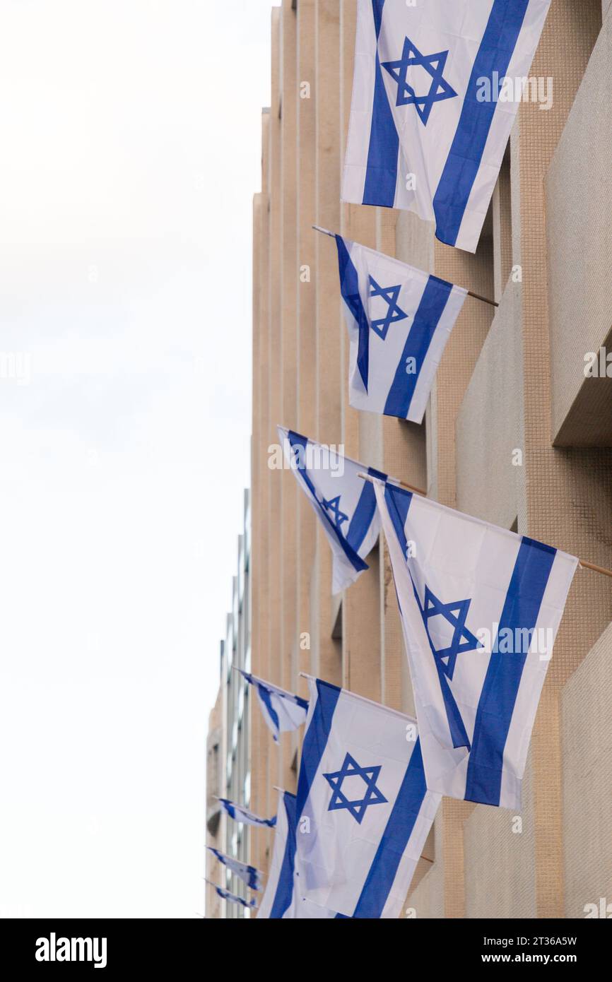 Tel Aviv, Israel - October 19, 2023 - Israel flags hung on bulding ...