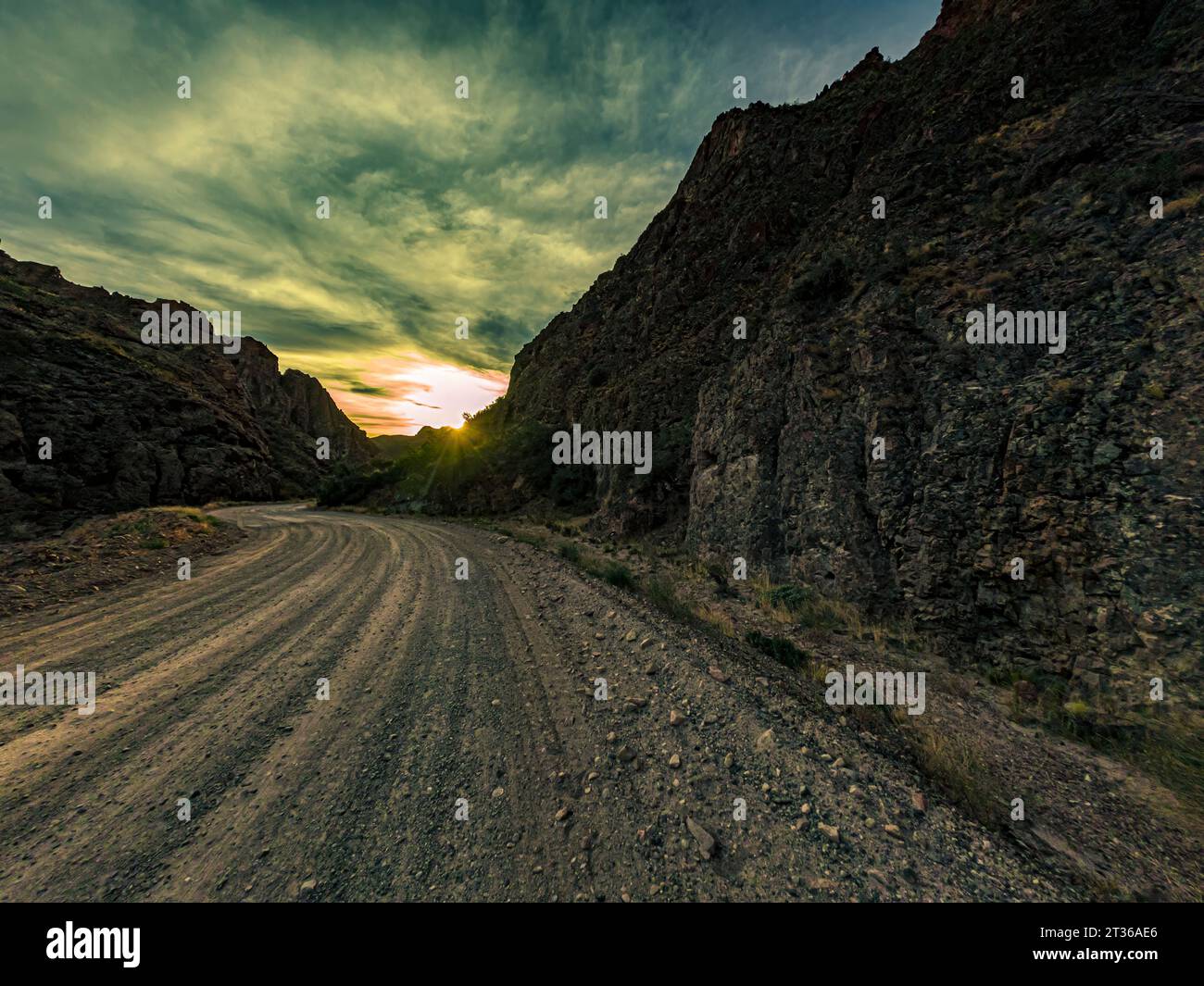 Sunset on a path between stone walls on the way to Florentino Ameghino ...