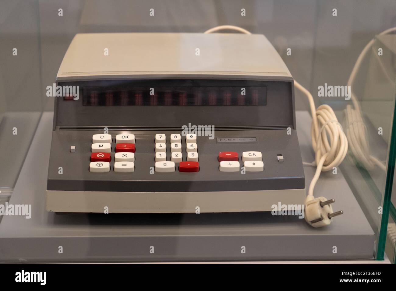 The first old calculator with a cord from an electrical outlet. Large ...