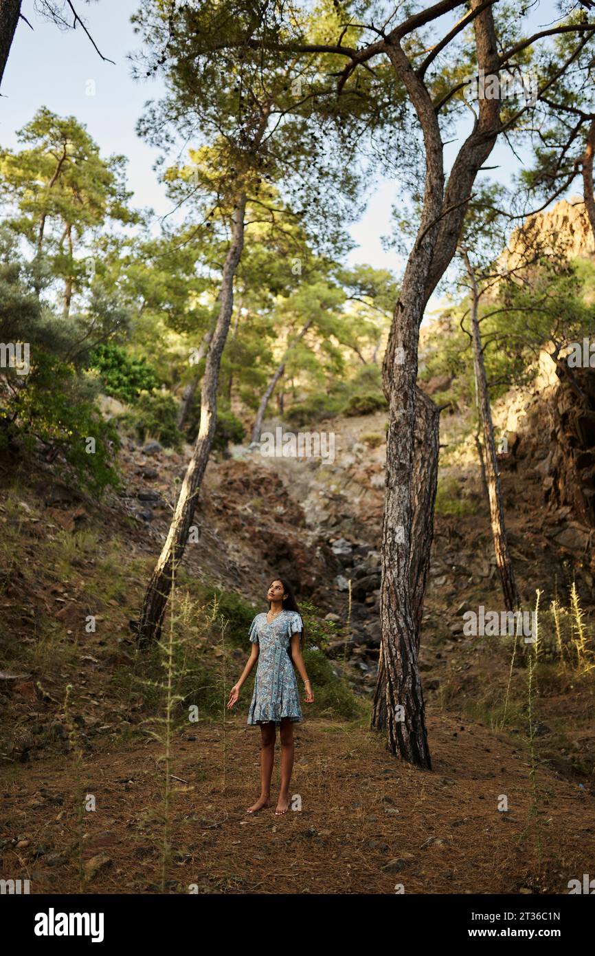 Girl standing near tree in hi-res stock photography and images - Alamy