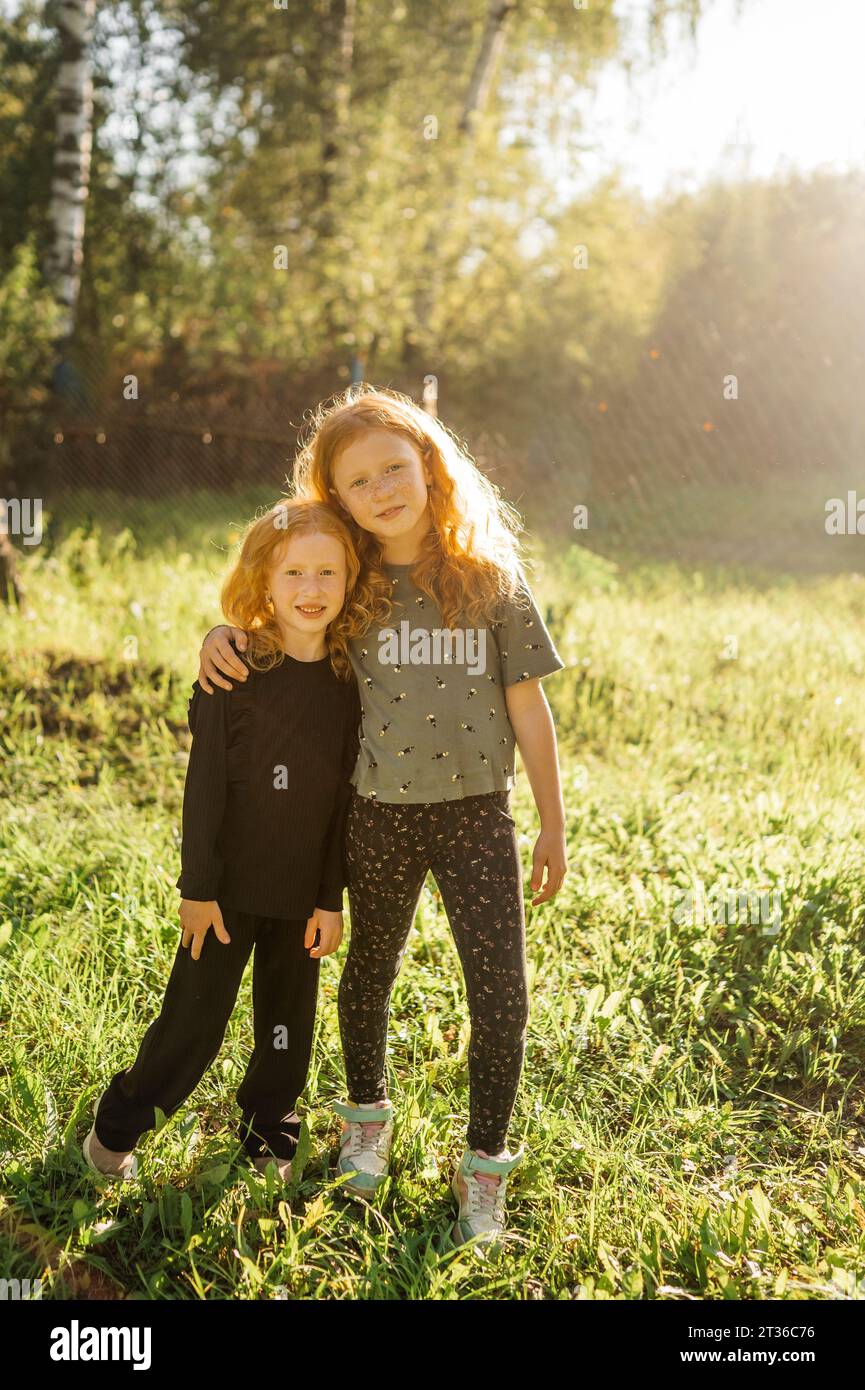 Two sisters outdoors park hi-res stock photography and images - Alamy