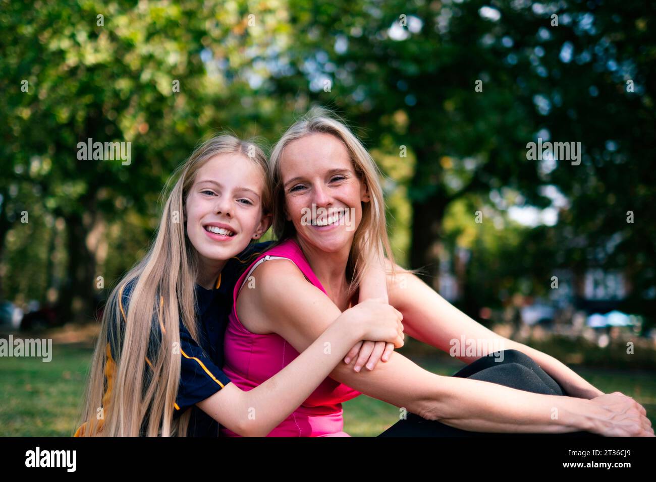 Sitting smiling arm around bonding childhood hi-res stock photography ...
