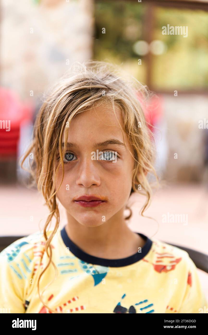 Child wearing blue shirt hi-res stock photography and images - Alamy