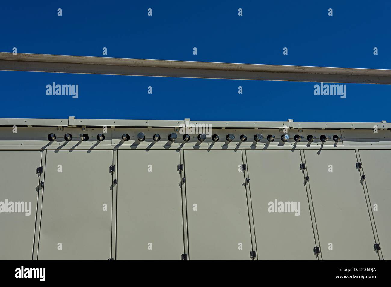 Capped pipe ends atop a compressor panel await mating pipe attachments ...