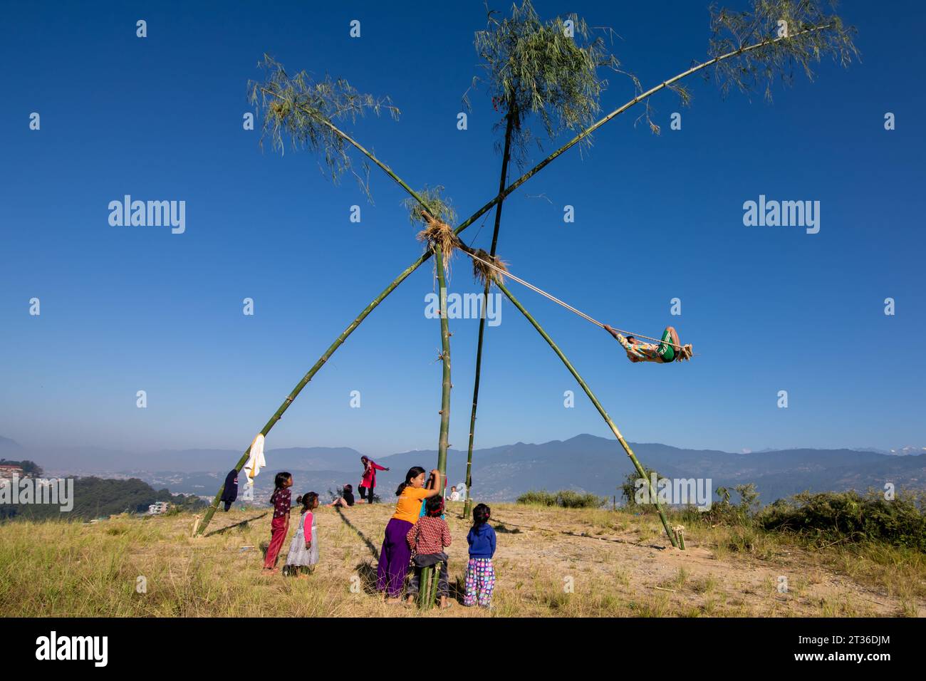 Playing swing on the precious occasion of the Dashain Festival, in ...