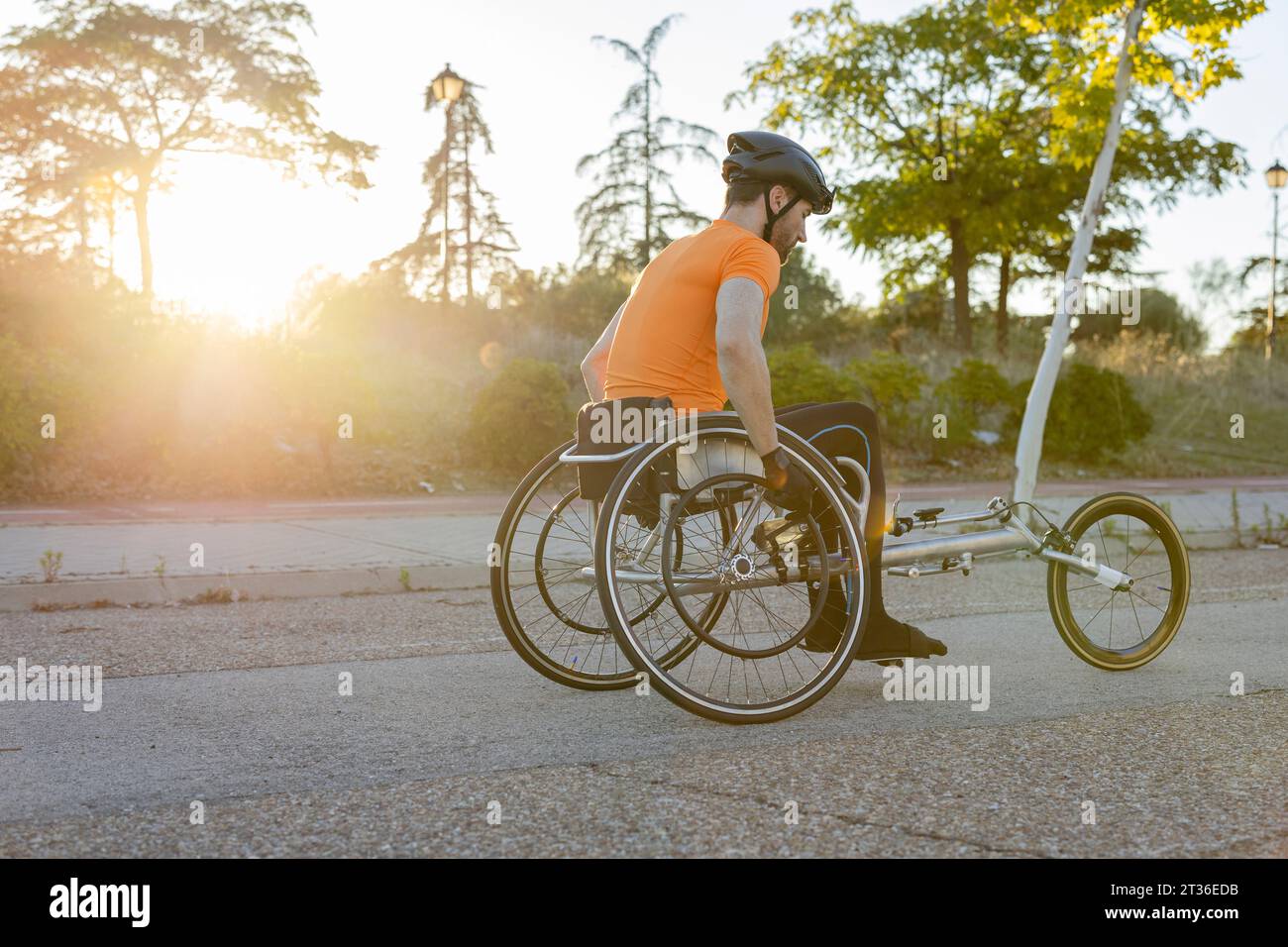 Athlete participates in wheelchair racing competition on road Stock ...