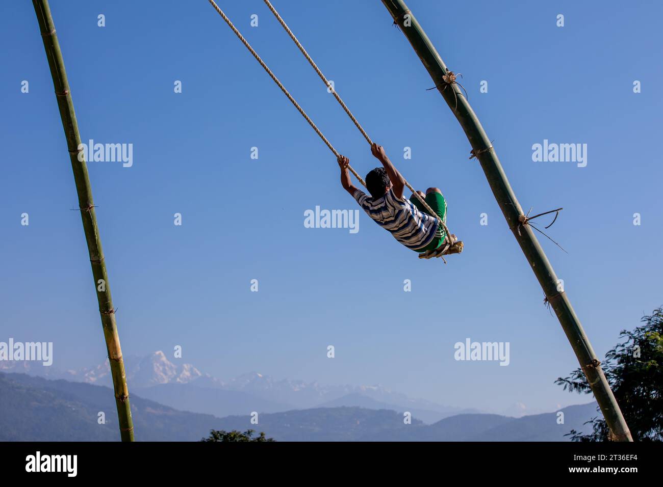 Playing swing on the precious occasion of the Dashain Festival, in ...