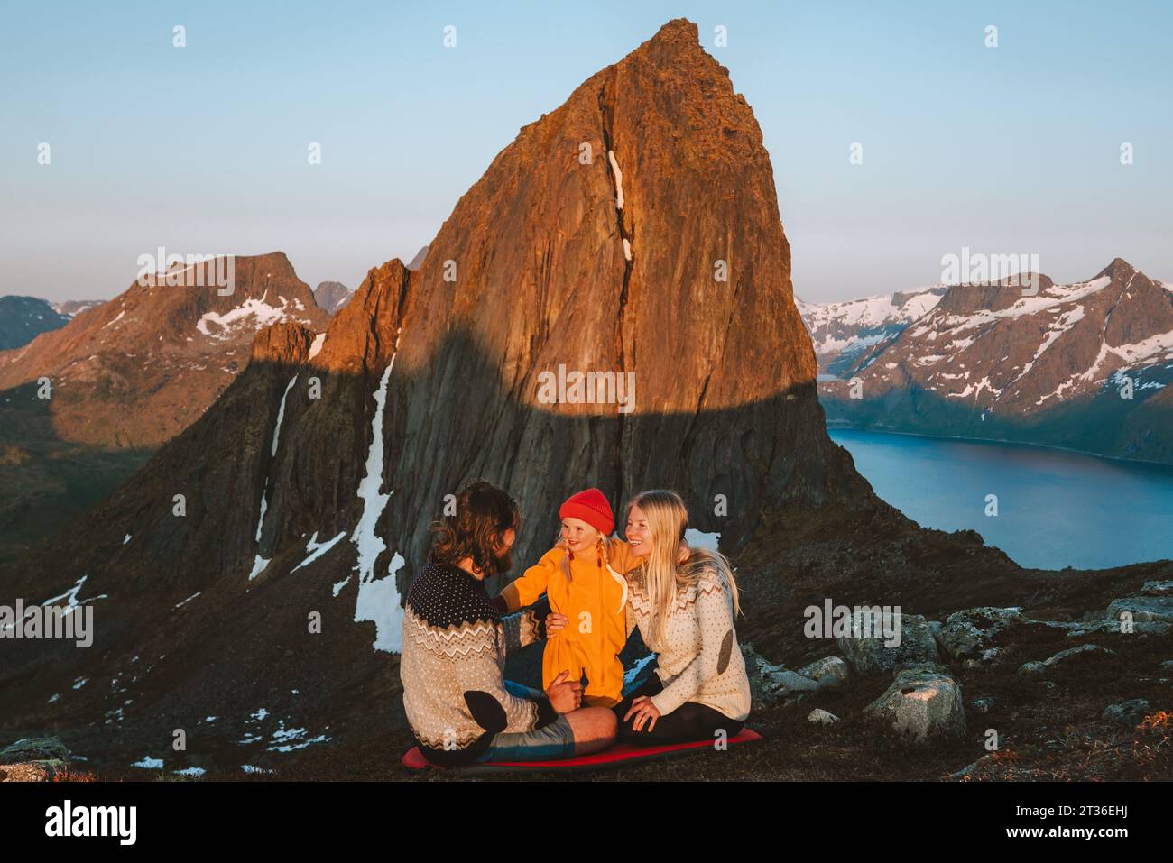 Family time outdoor child and parents hiking together in Norway travel ...