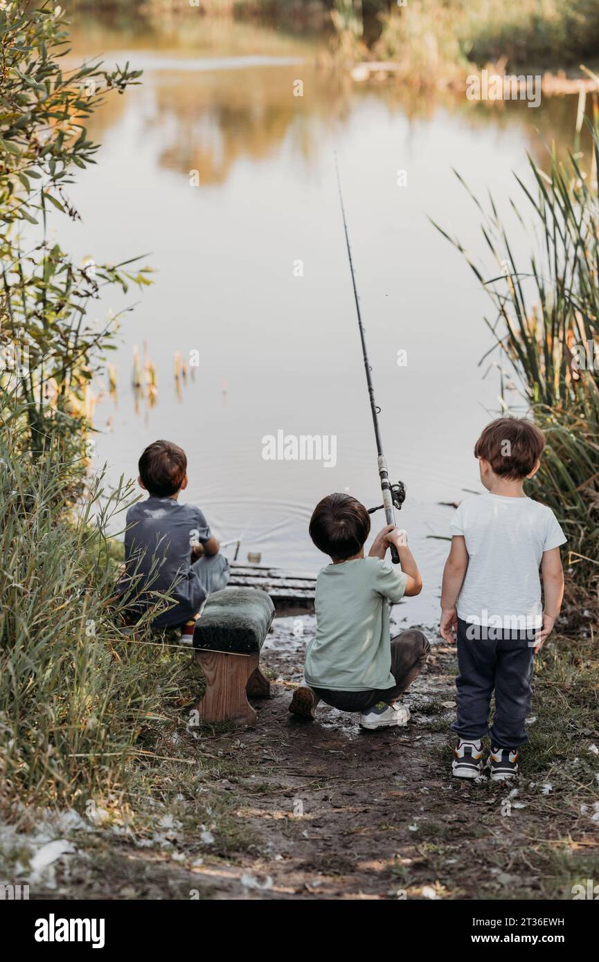 Children fishing with rod hi-res stock photography and images - Alamy