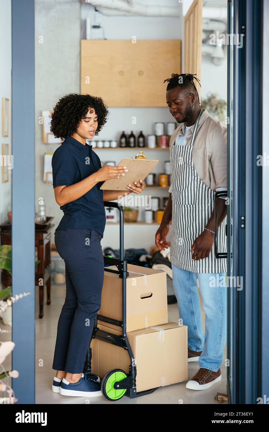 African waiter holding service hi-res stock photography and images - Alamy
