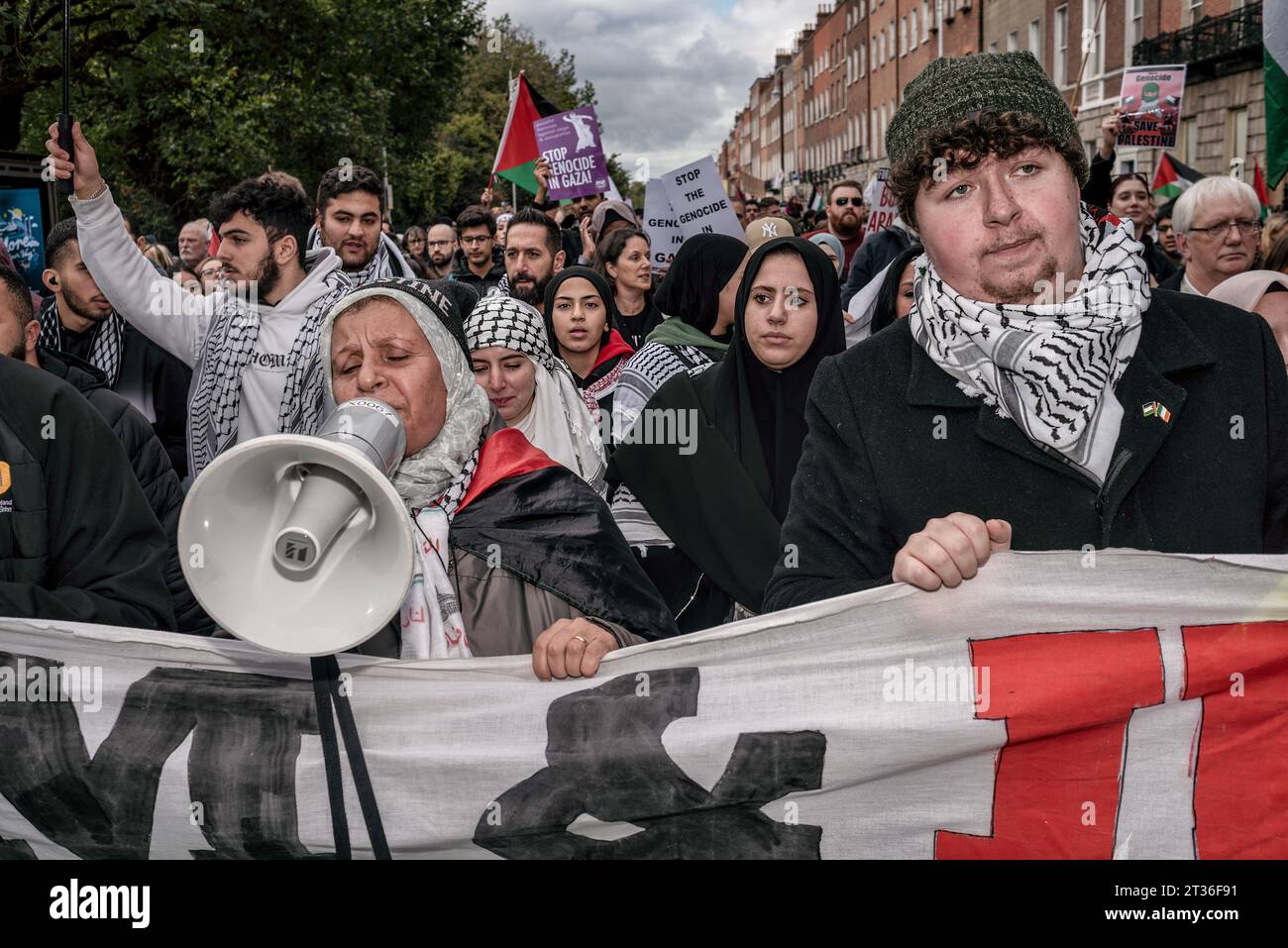 Dublin, Ireland. 21st Oct, 2023. A protester chants through a megaphone ...