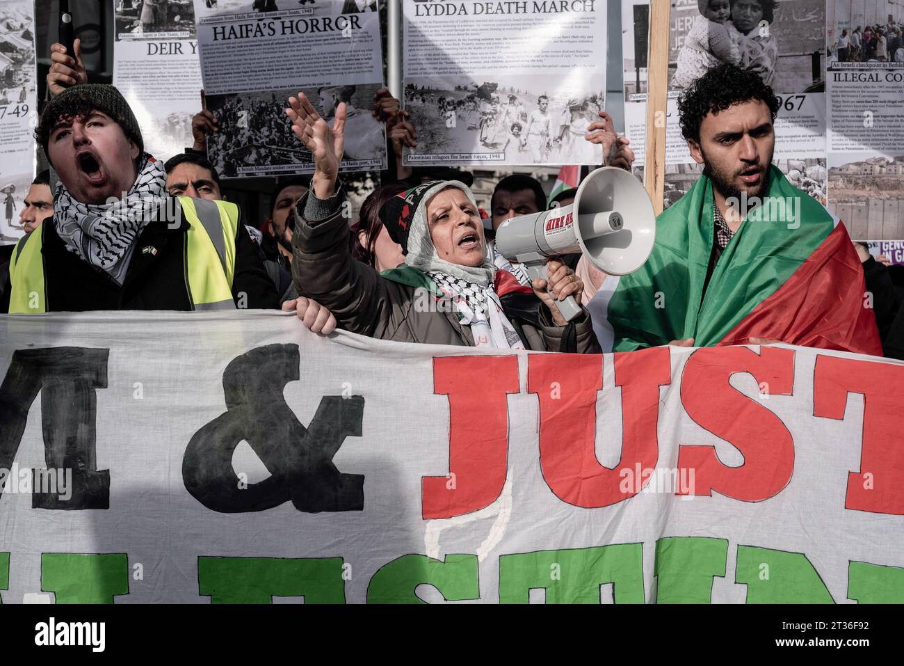 Dublin, Ireland. 21st Oct, 2023. A protester chants through a megaphone ...