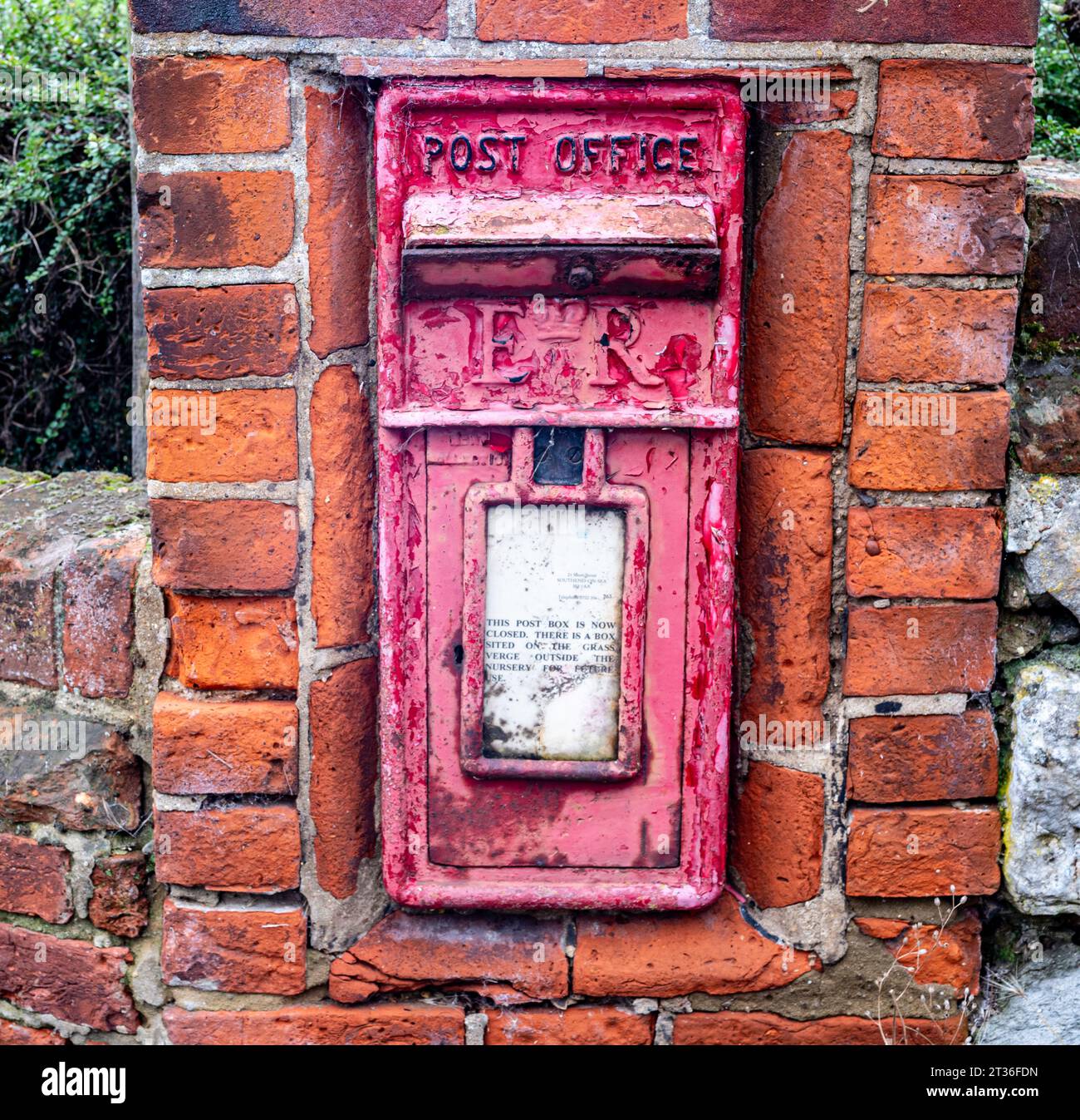 Old unused postbox set in brick at Rawreth village, Essex Stock Photo ...