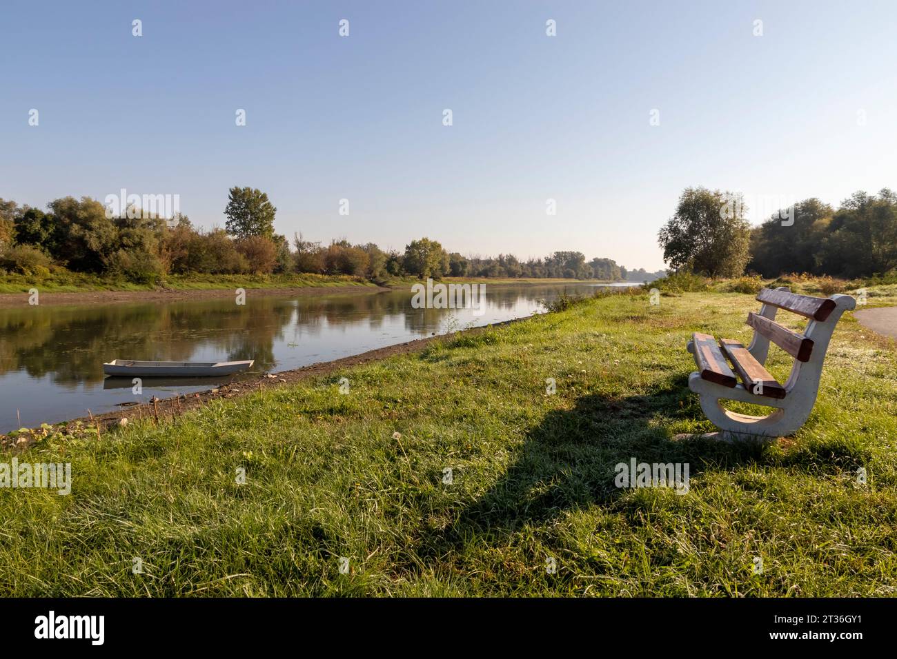 Park bench by river Begej Stock Photo - Alamy