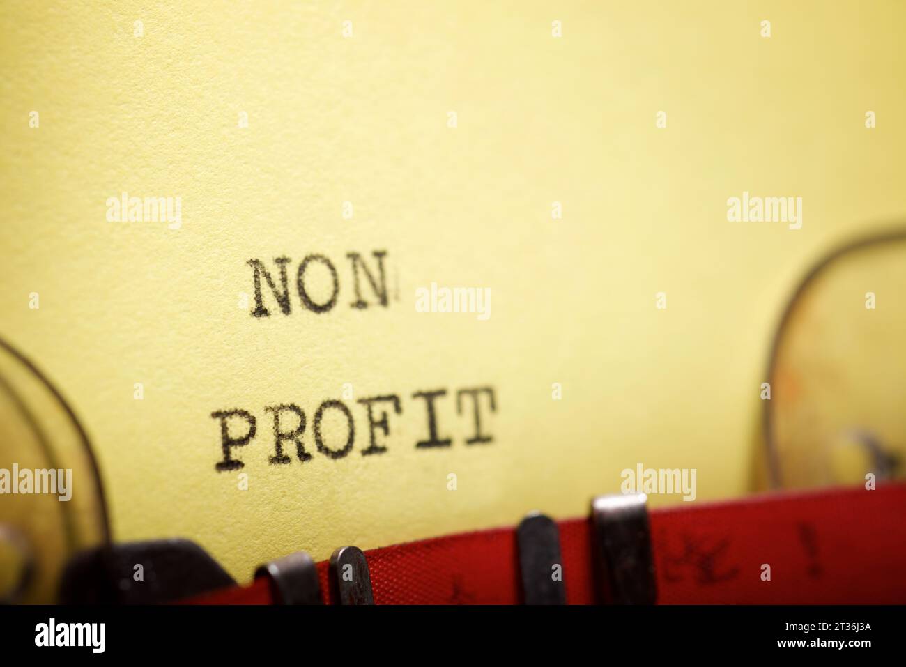 Non profit text written with a typewriter Stock Photo - Alamy