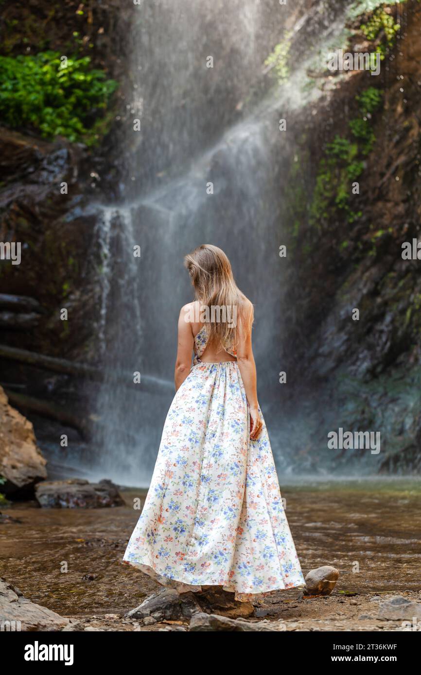Young woman backpacker looking waterfall hi-res stock photography and ...