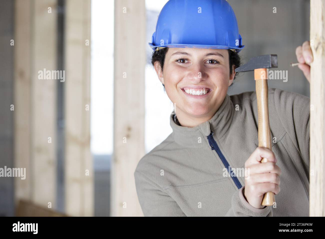 smiling builder worker in orange protectiive cask isolated on white ...
