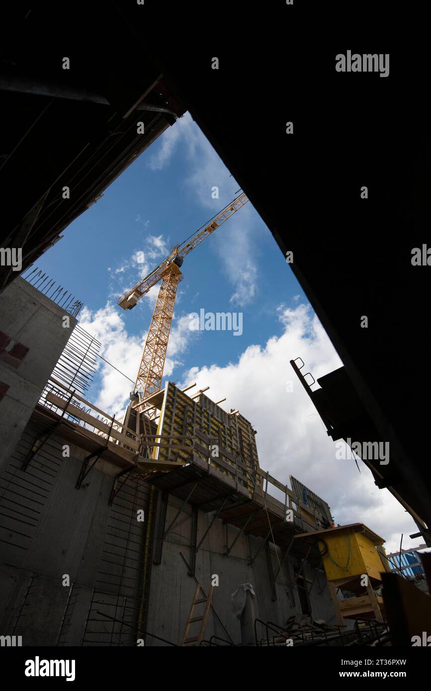 Construction crane in building industry, heavy machine at construction ...