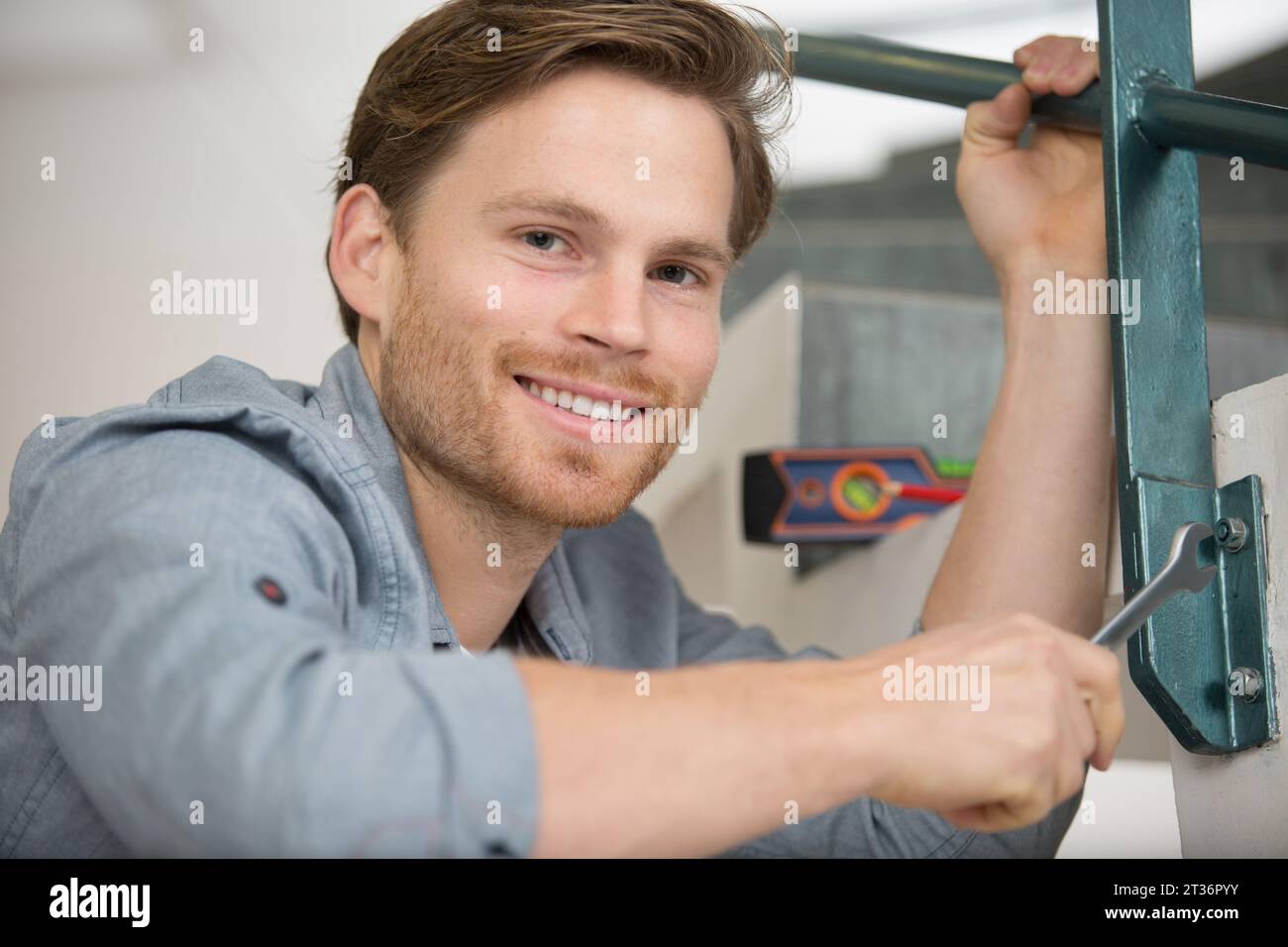 portrait of handsome repairman at work Stock Photo - Alamy