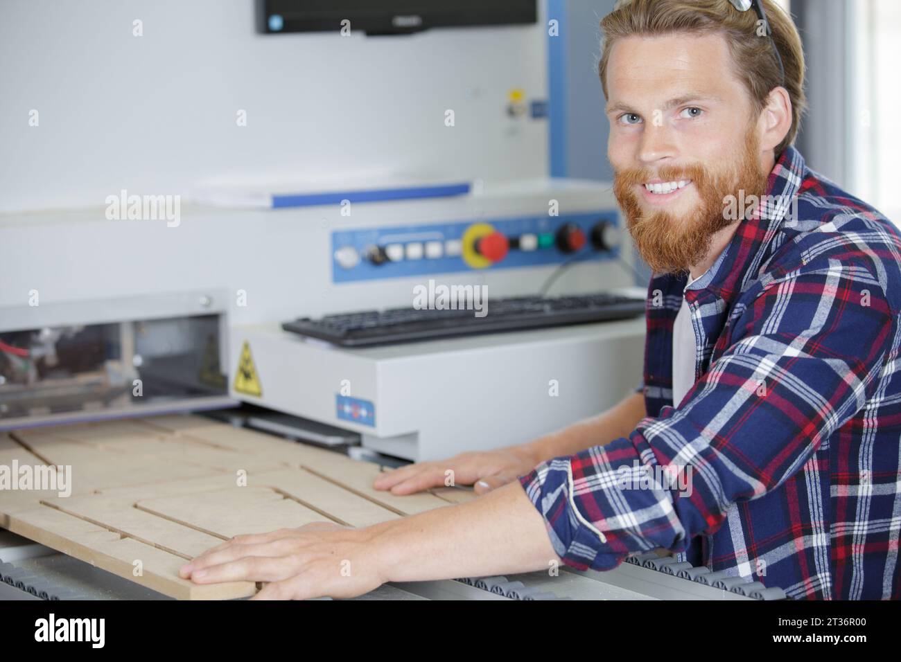 craftsman using wood cutting machine Stock Photo - Alamy