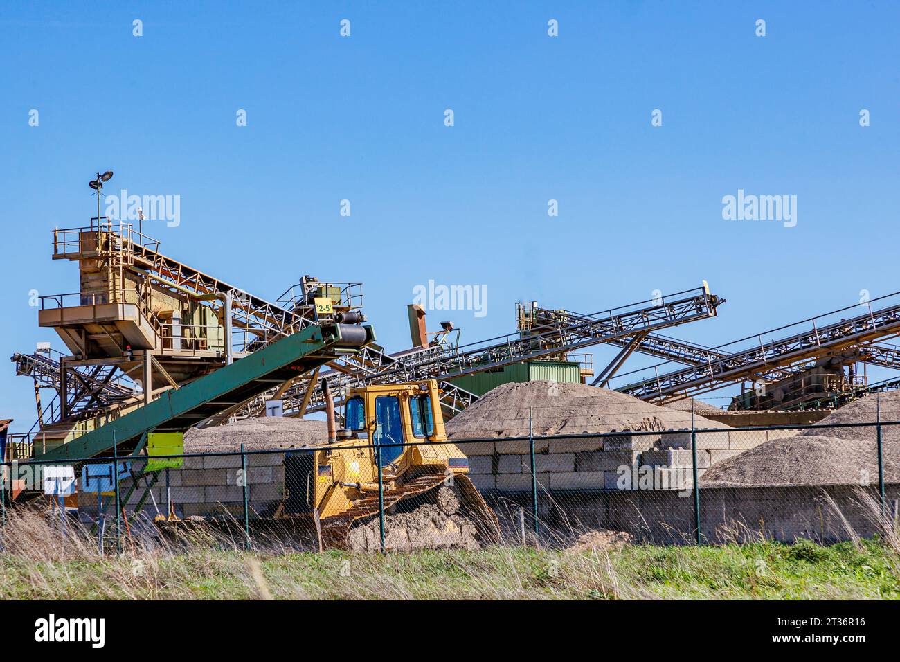 Gravel, sand and earth extraction work site, heavy industrial ...