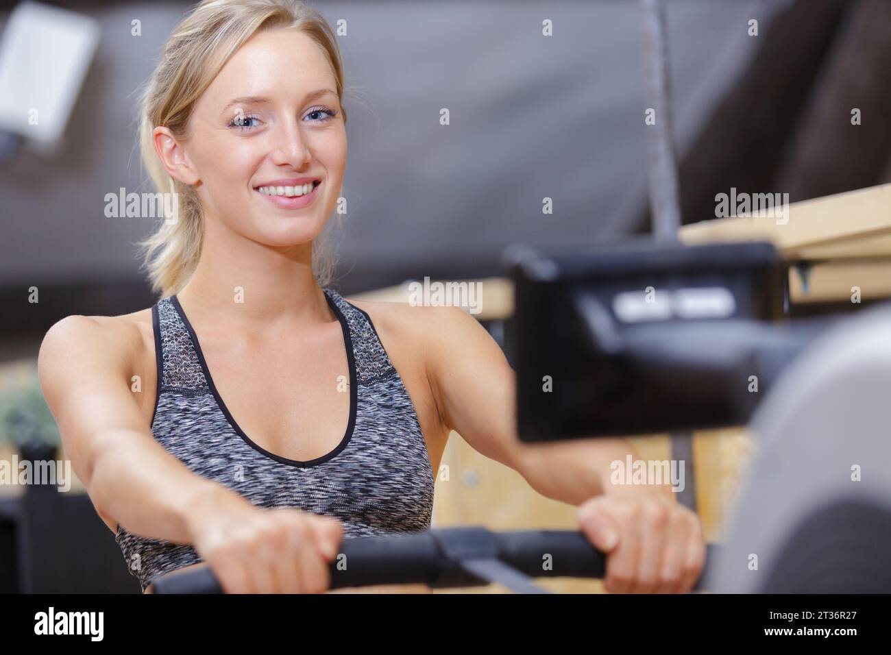 Woman practicing rowing exercise hi-res stock photography and images ...