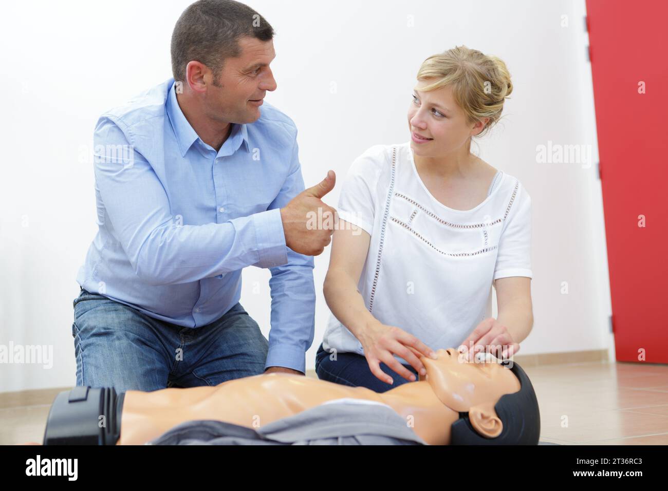 first aid training doing cpr Stock Photo - Alamy