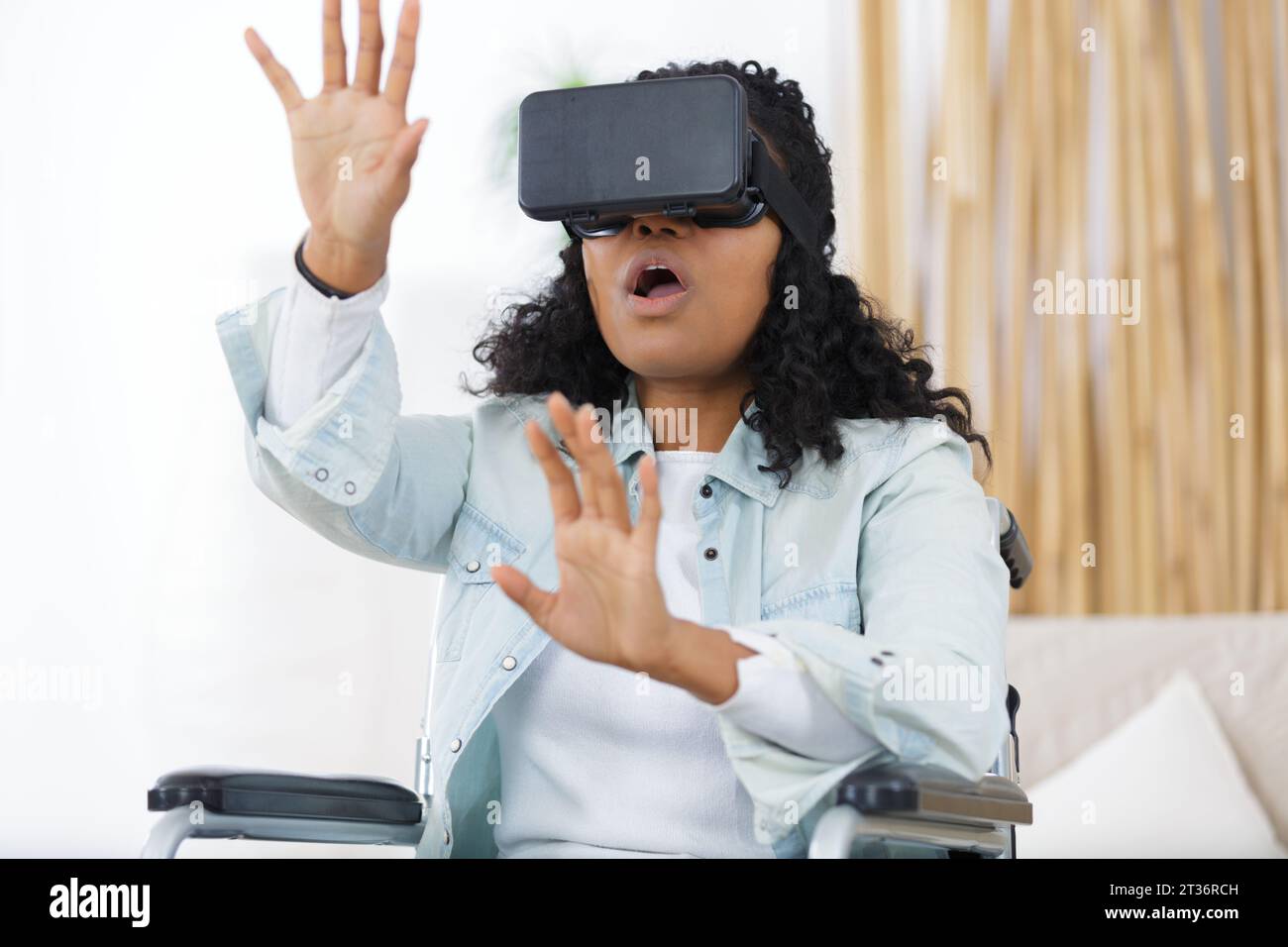 side view of woman on wheelchair using virtual reality mask Stock Photo ...