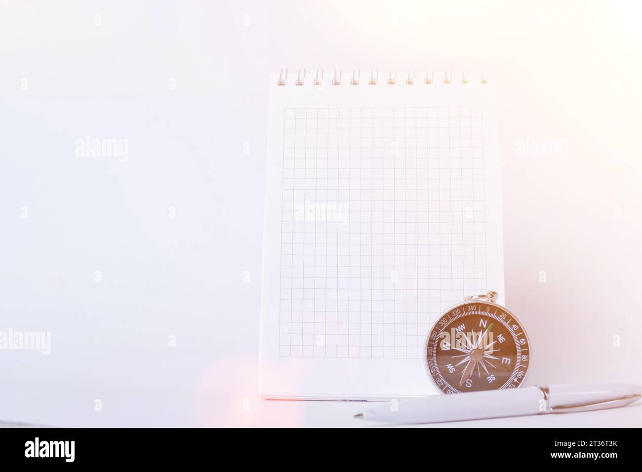 Traveler's notes. A clean notebook with a pen for writing a compass and ...