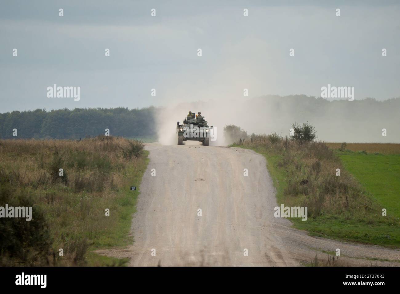 British army FV510 Warrior Infantry Fighting Vehicle throwing up clouds ...
