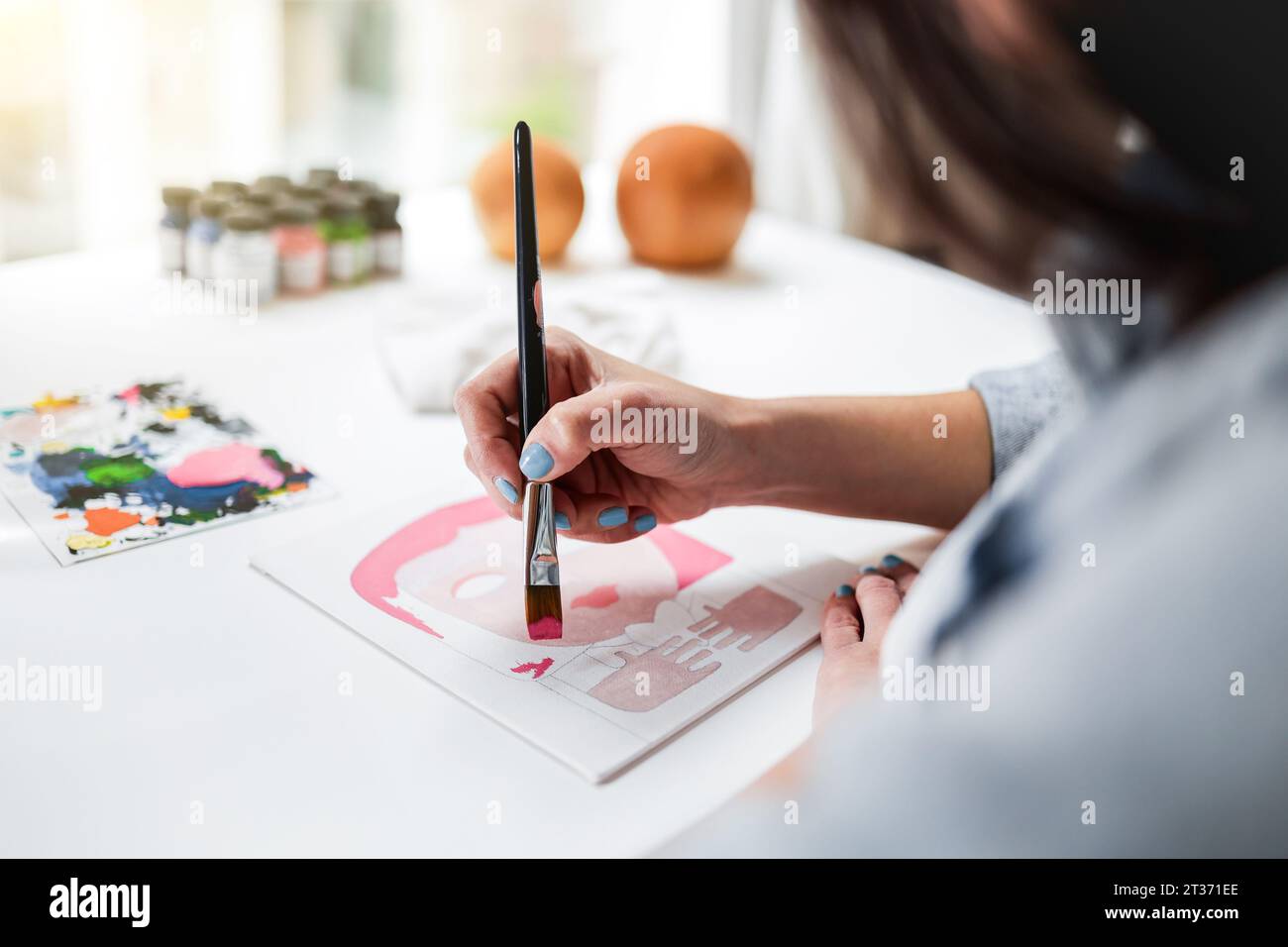 Artist painting on canvas inside school studio - Education and art life ...