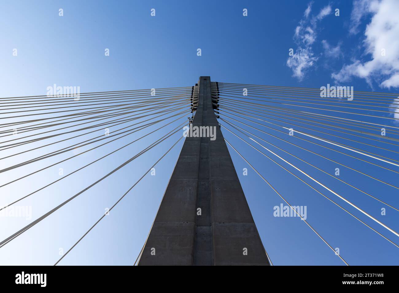 Fixing the ropes in the concrete pylon of the rope bridge. View of the ...