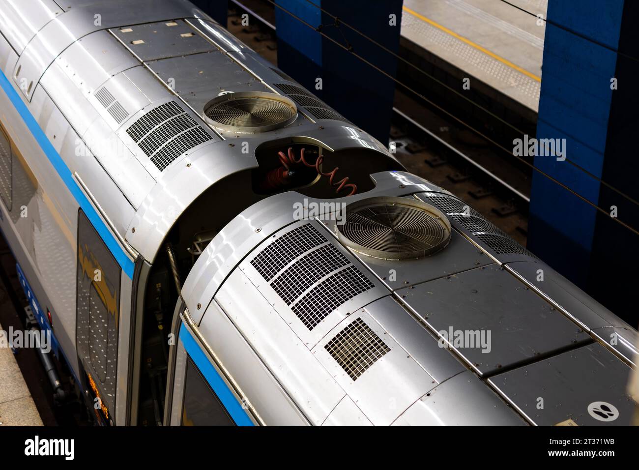 Passenger train carriages on the railway station platform seen from ...