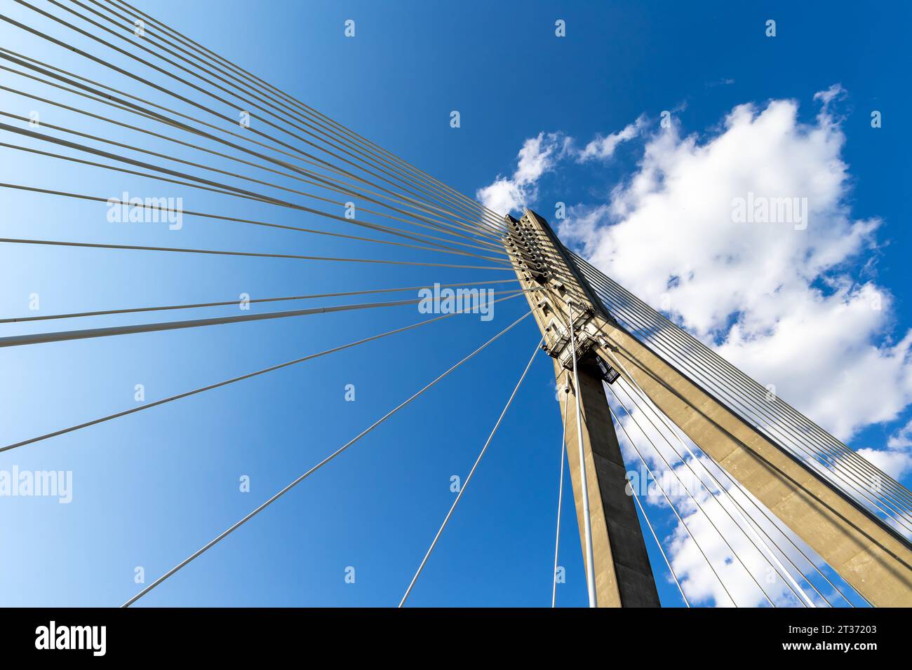 Fixing the ropes in the concrete pylon of the rope bridge. View of the ...