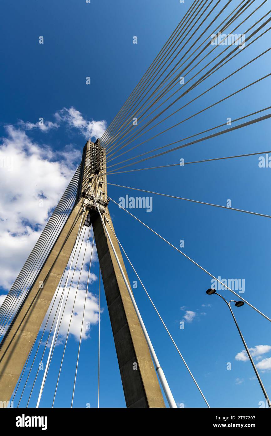 Fixing the ropes in the concrete pylon of the rope bridge. View of the ...