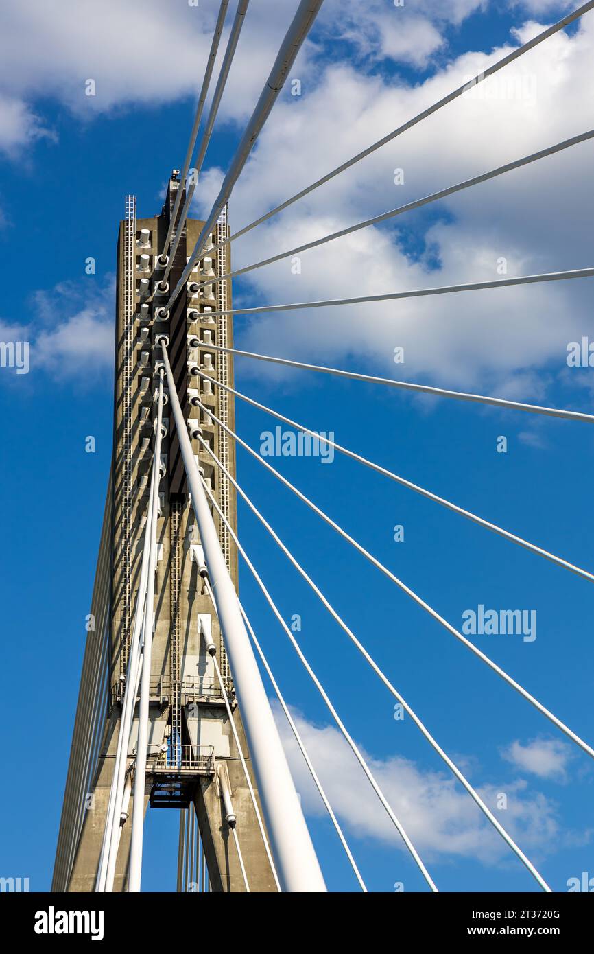 Fixing the ropes in the concrete pylon of the rope bridge. View of the ...