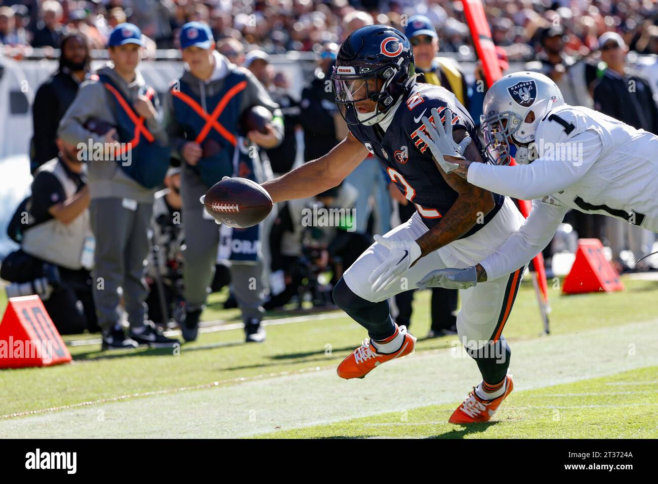 Chicago Bears wide receiver DJ Moore, left, is stopped short of the ...