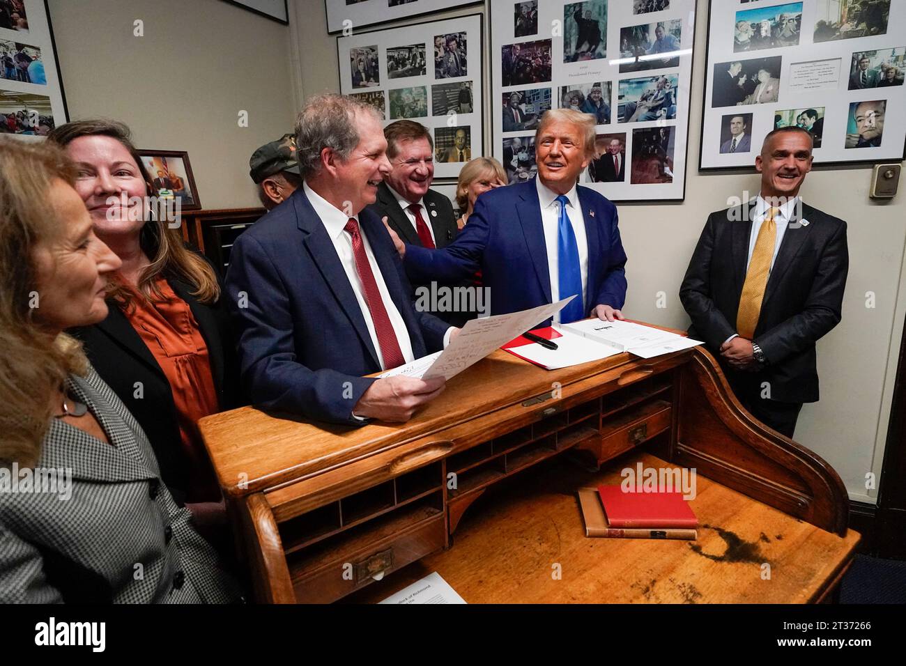 Republican presidential candidate former President Donald Trump talks with New Hampshire ...