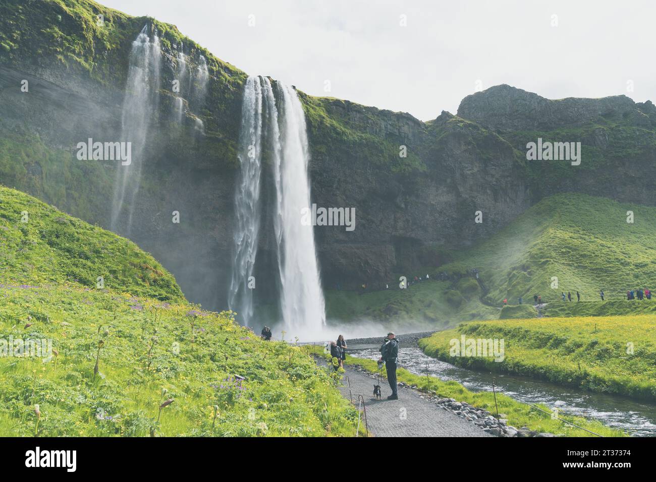 Seljalandsfoss, Iceland - July 8, 2023: Tourists on the trail to walk ...