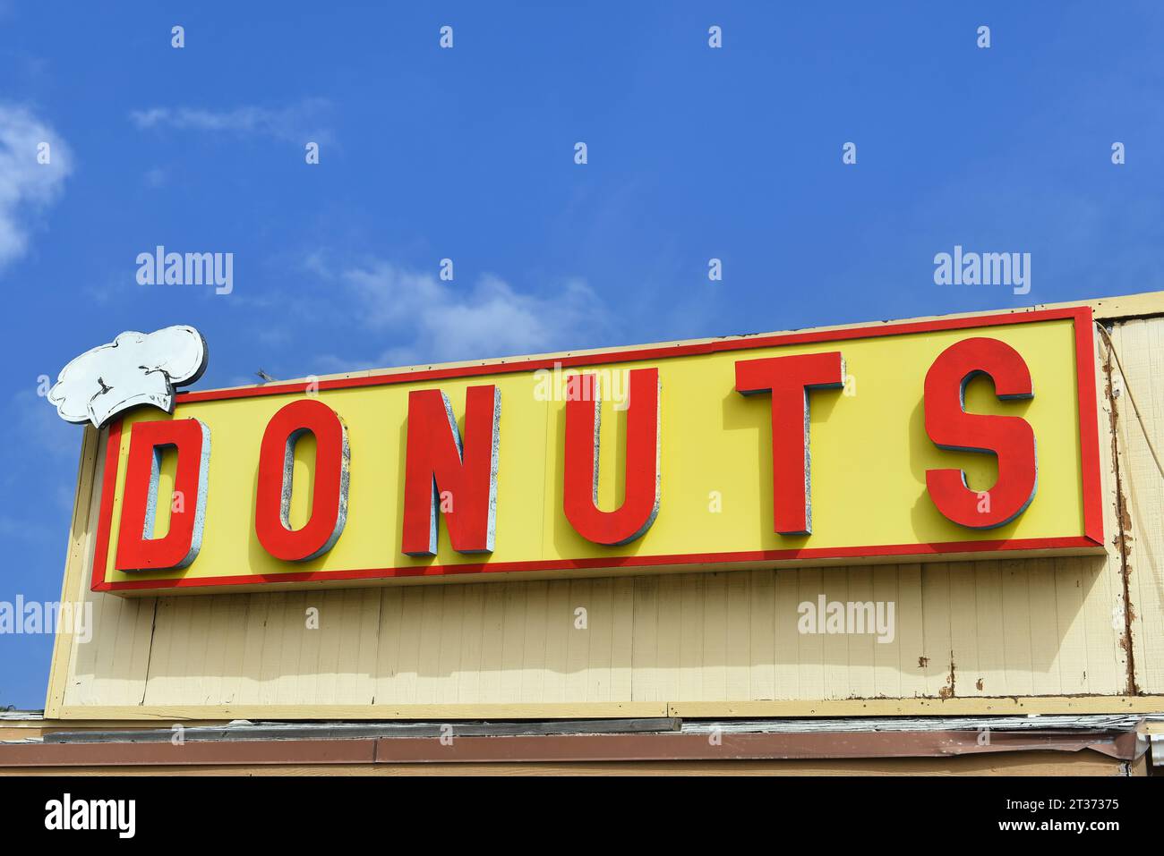 COSTA MESA, CALIFORNIA - 18 OCT 2023: Closeup of the Donuts sign at the ...